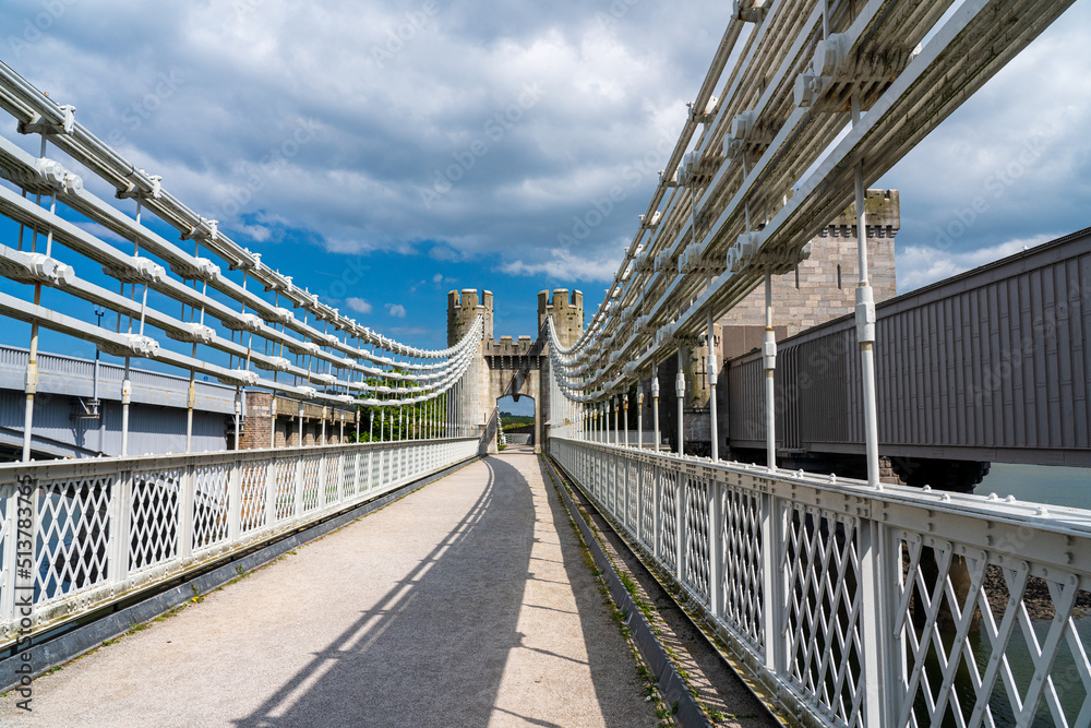 Fotka „Historic Thomas Telford suspension bridge leading to the ancient ...