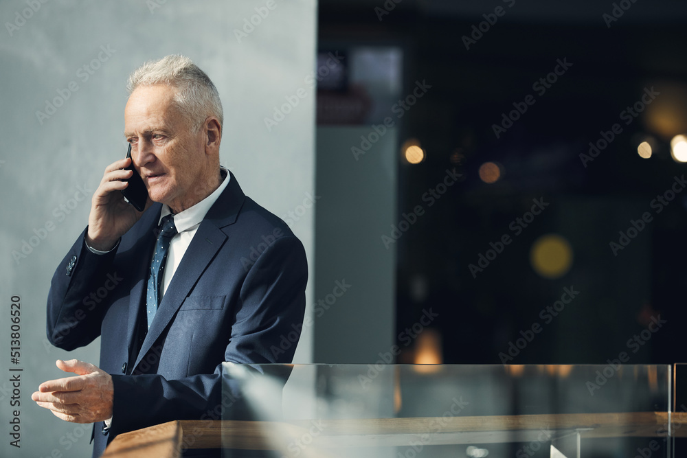 Concerned senior business manager in suit leaning on railing in hall ...