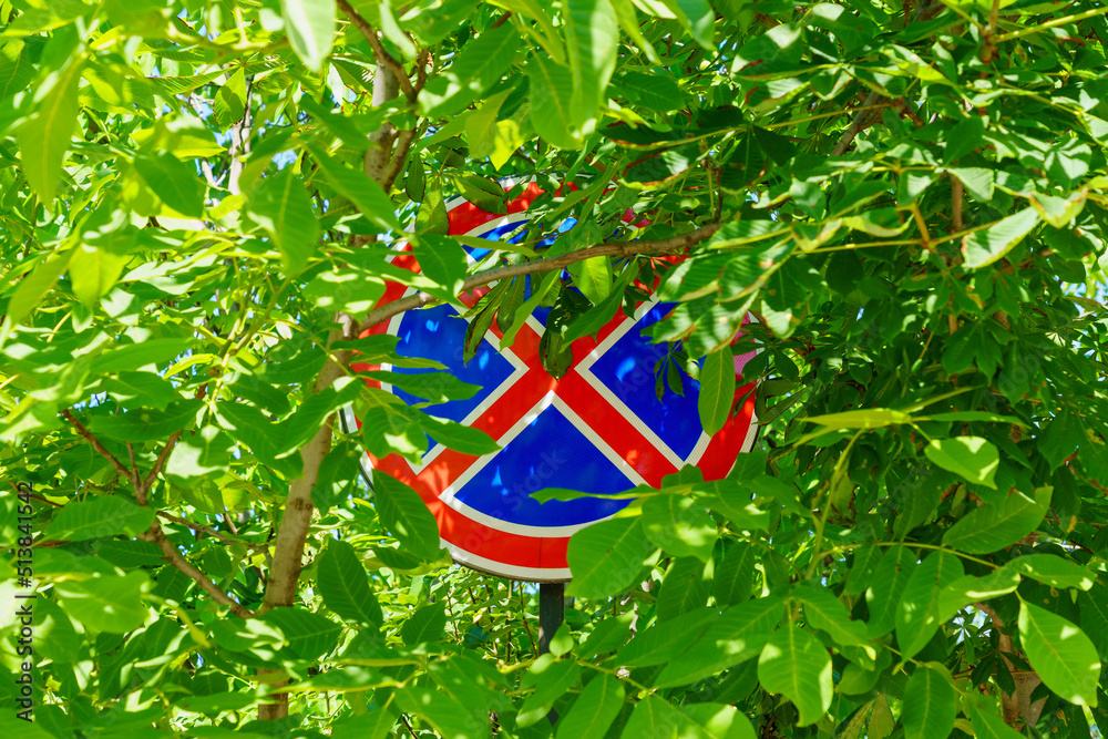 Road sign Stop Prohibited Closed Foliage. Poor visibility of ...