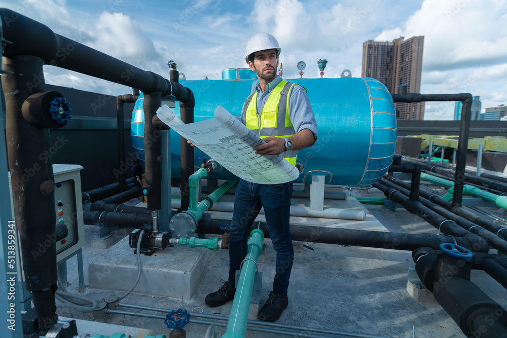 Engineer under checking the industry chilled water fan coil unit air ...