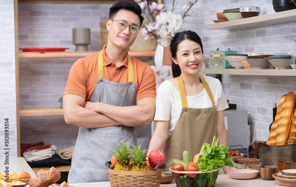 Image of young Asian couple cooking in the kitchen Stock Photo | Adobe ...