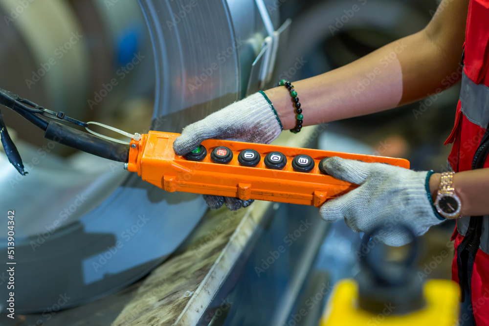 Hand using remote control overhead cranes remote. Foreman or worker ...