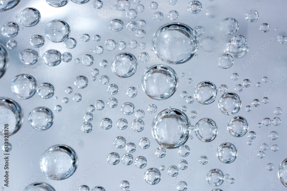 Bubbles in carbonated water. Background of water with bubbles closeup, soda. Refreshing cool ...