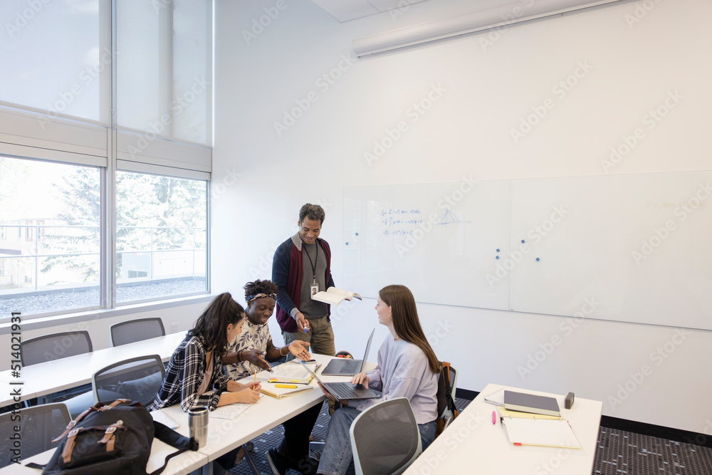 College professor and students talking in classroom Stock Photo | Adobe ...