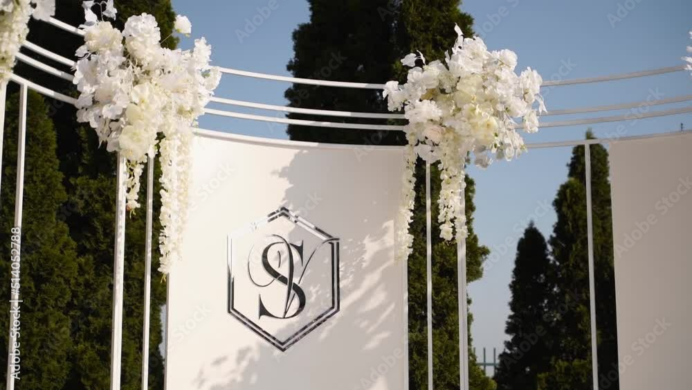 Decorated wedding ceremony arch background with initials of bride anf ...
