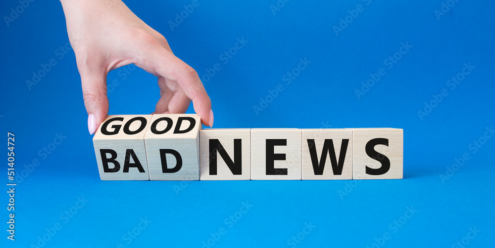 Good news and Bad news symbol. Businessman hand turns wooden cubes and ...