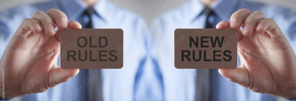 Human hands showing Old Rules and New Rules text. Stock Photo | Adobe Stock