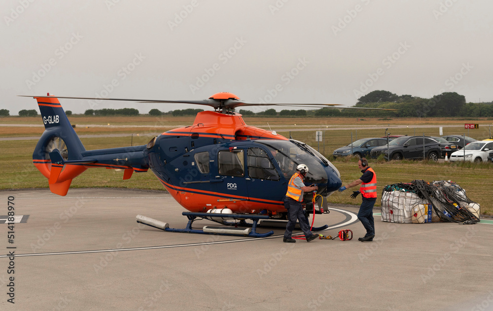 Cornwall, England, UK.2022. Airlift helicopter ground crew attaching ...