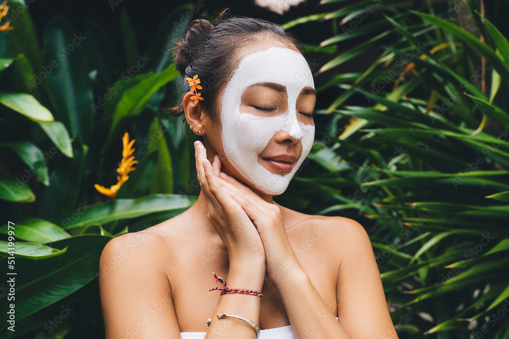 Attractive woman with closed eyes enjoying moisturize time for ...
