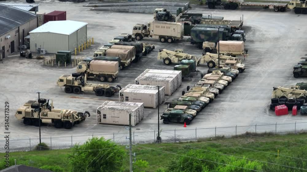USA Army Depot with trucks and Humvee equipment storage ready for war ...