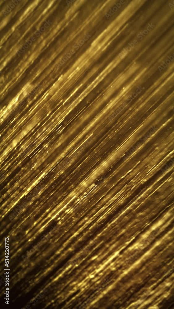 Abstract Gold Filaments Bursting Background/ 4k animation of a vertical ...