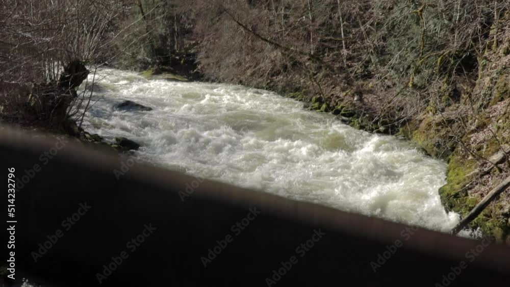 Stockvideon shot from top to bottom blocked by wooden bridge. Water ...
