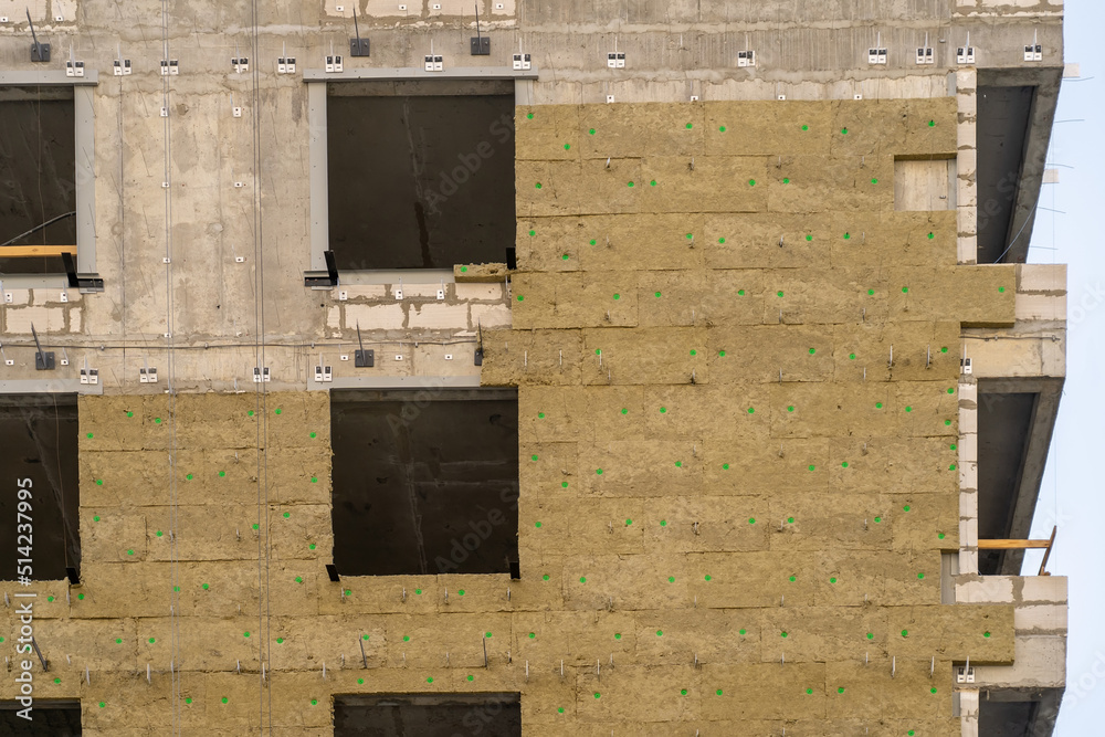 Installation of external wall thermal insulation with rock wool ...