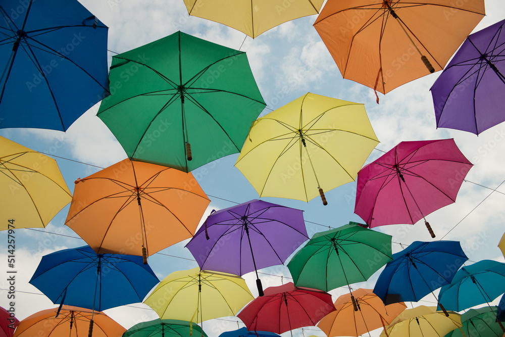 colorful umbrellas background hanging in blue sky Stock Photo | Adobe Stock