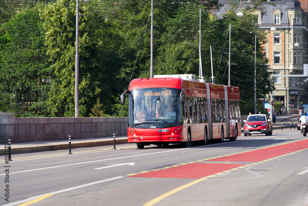 Lorraine Bridge with red trolley bus line 20 at City of Bern, capital ...