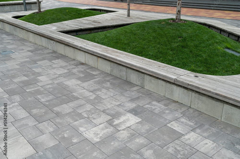 Walkway with curve and seating with tiles in different colors Stock ...