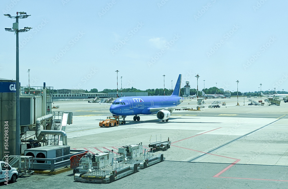 LINATE AIRPORT, ITALY - JUNE 12, 2022: Airport operations with ...