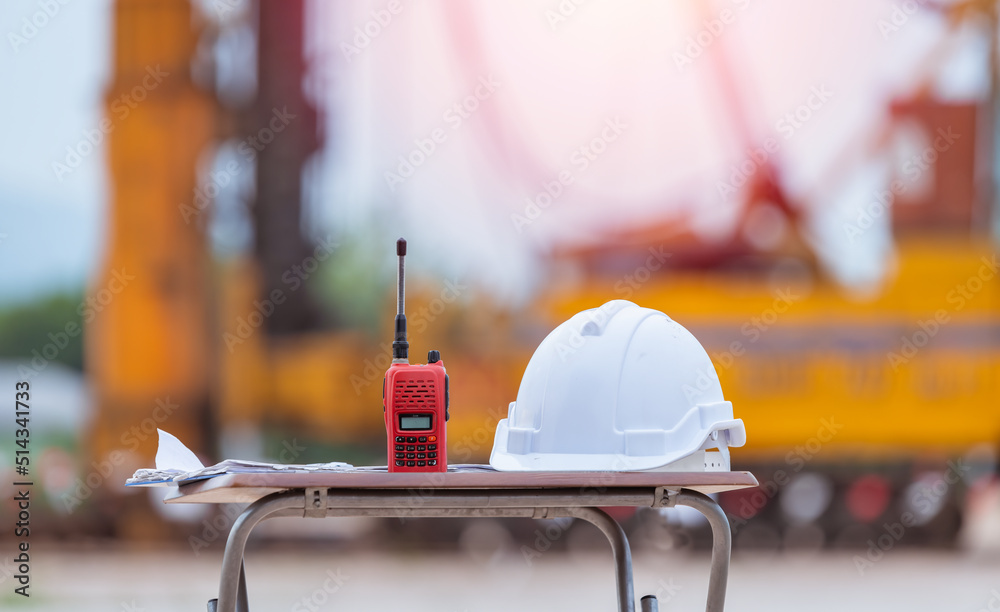 White safety helmet engineer and radio communication at road ...