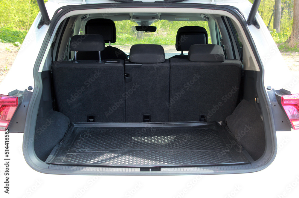 Open tailgate on a luxury estate. Clean, open empty trunk in the car ...