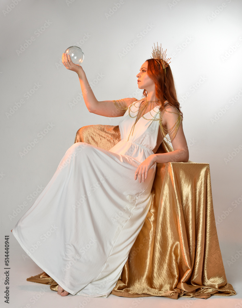 Full length portrait of beautiful red head woman wearing long flowing ...