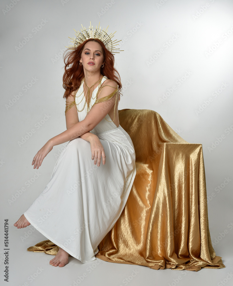Full length portrait of beautiful red head woman wearing long flowing ...