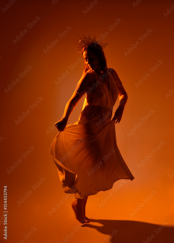 portrait of beautiful red-haired woman wearing long flowing fantasy ...