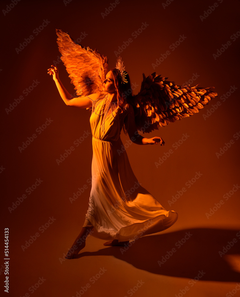 Full length portrait of beautiful red head woman wearing long flowing ...