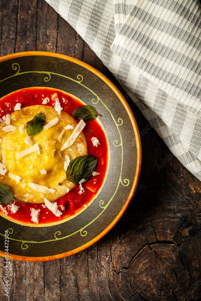 Ricotta ravioli with honey, walnuts and chives in cherry tomato sauce ...