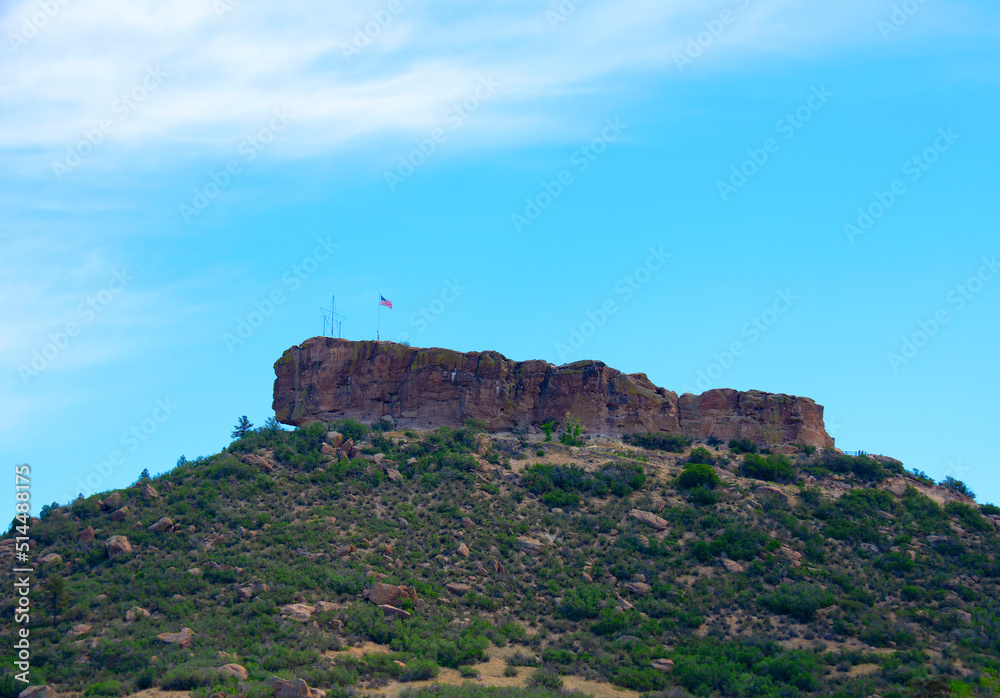 Iconic landmark butte Castle Rock in its namesake city in Colorado with ...