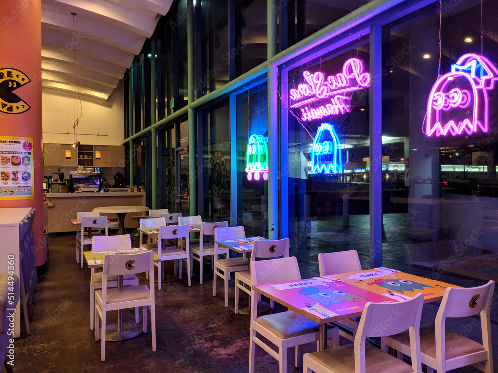 Pac-Man Tables and Neon signs at pop-up Pac-Store Stock Photo | Adobe Stock