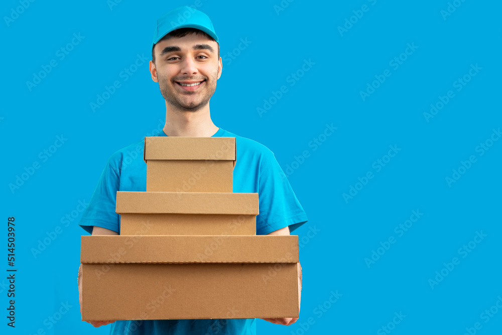 Delivery man with a box. Courier in uniform cap and t-shirt service ...
