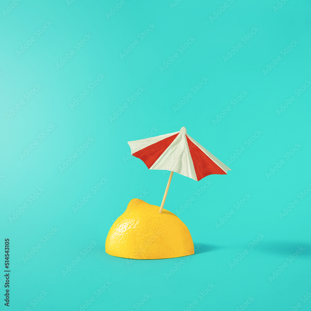 Tropical beach concept made of lemon and sun umbrella. Summer creative ...