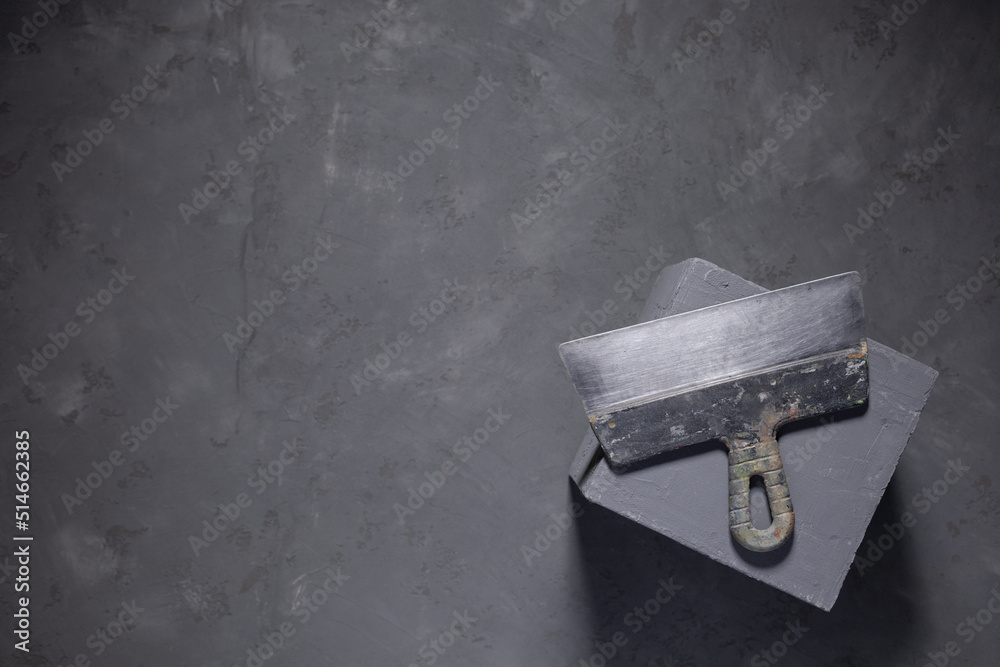 Concrete cube and construction work tools on floor background texture ...