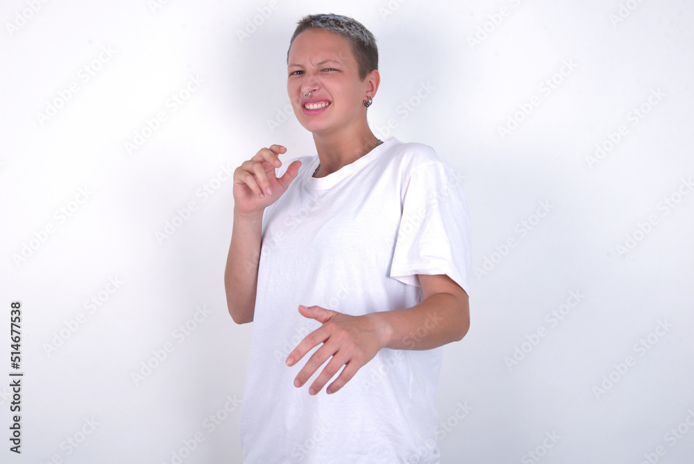 Ugh how disgusting! Displeased young woman with short hair wearing ...