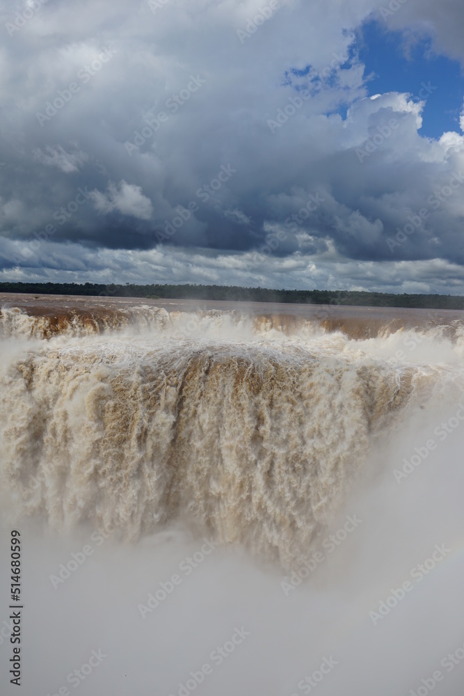 The photo shows a stunning view from the top of the Iguazu Falls — a ...