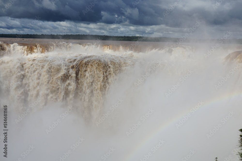 The photo shows a stunning view from the top of the Iguazu Falls — a ...