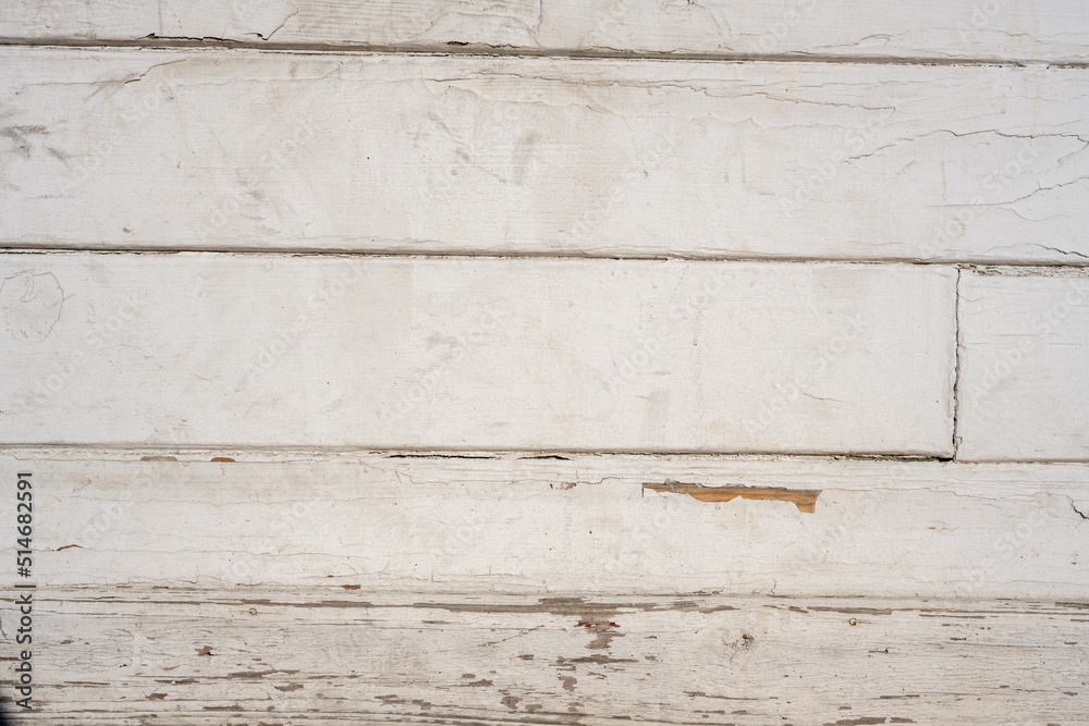 Dirty, old, blistered and flaking, repainted old white painted board ...
