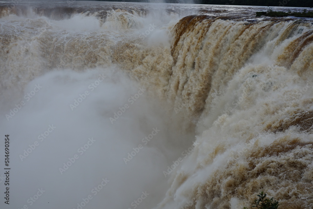 The photo shows a stunning view from the top of the Iguazu Falls — a ...