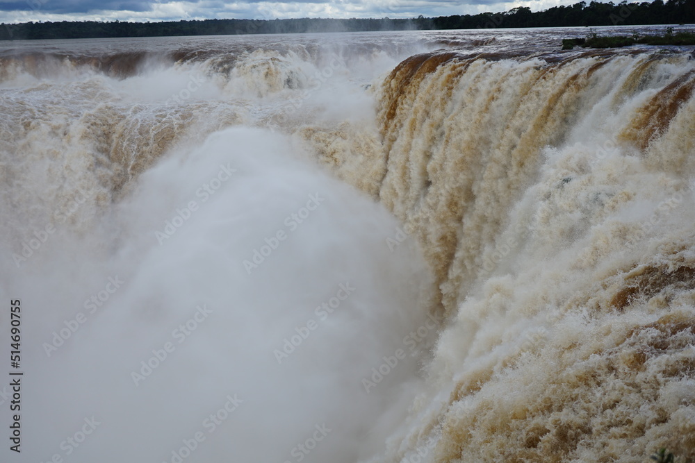 The photo shows a stunning view from the top of the Iguazu Falls — a ...