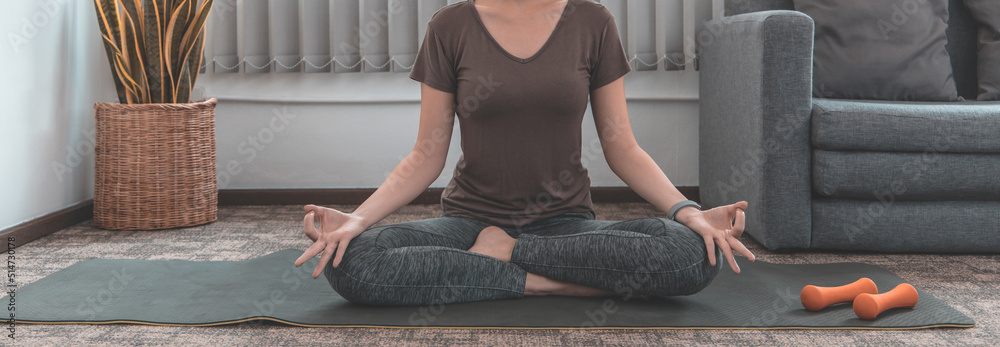 Slim fit Asian woman Internet coach yoga and meditation coaching videos ...