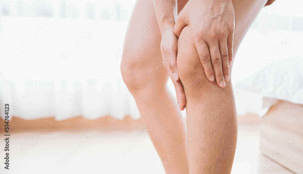 Woman hands touching her knee area. Bone pain, Trauma or Torn ligament ...
