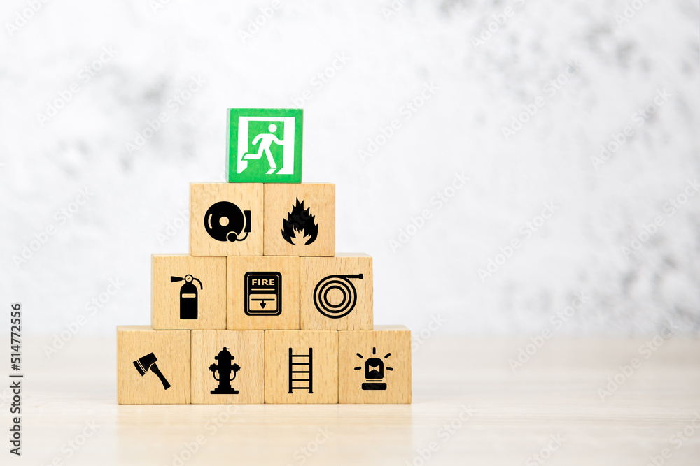Cube wooden block stack with fire prevent icon and door exit sing or ...