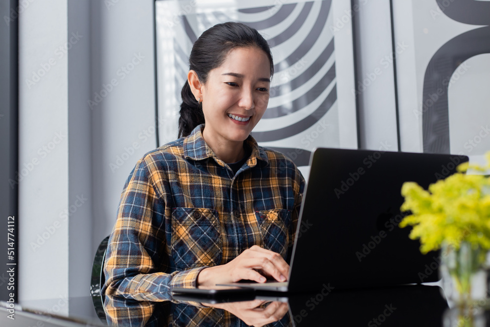 Foto de woman work using texting cell phone typing computer.student ...
