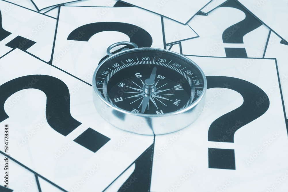 Find right way concept. Compass on question marks background. Stock ...
