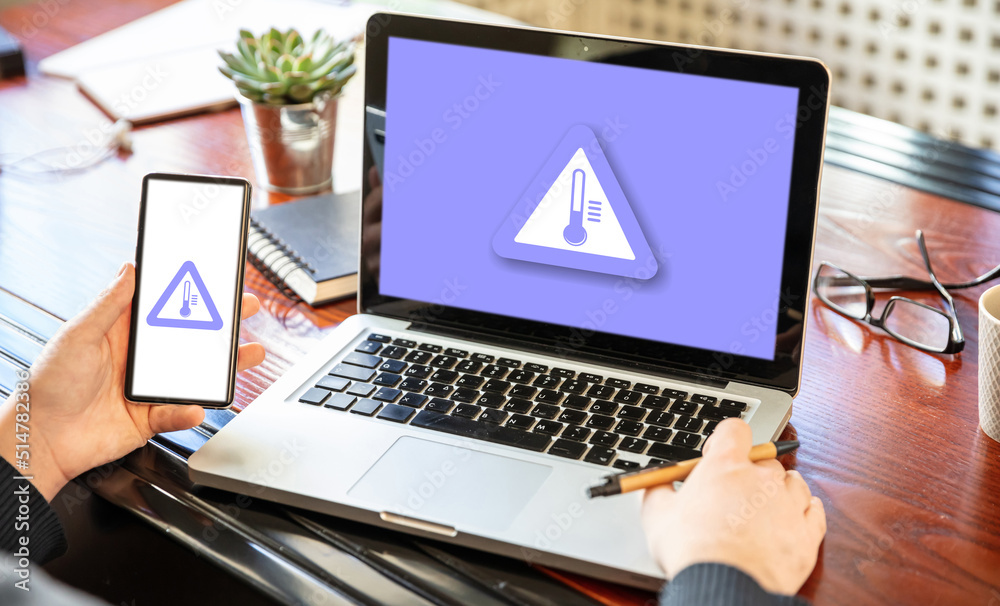 High temperature warning sign on a Computer and mobile screen. Overheat ...