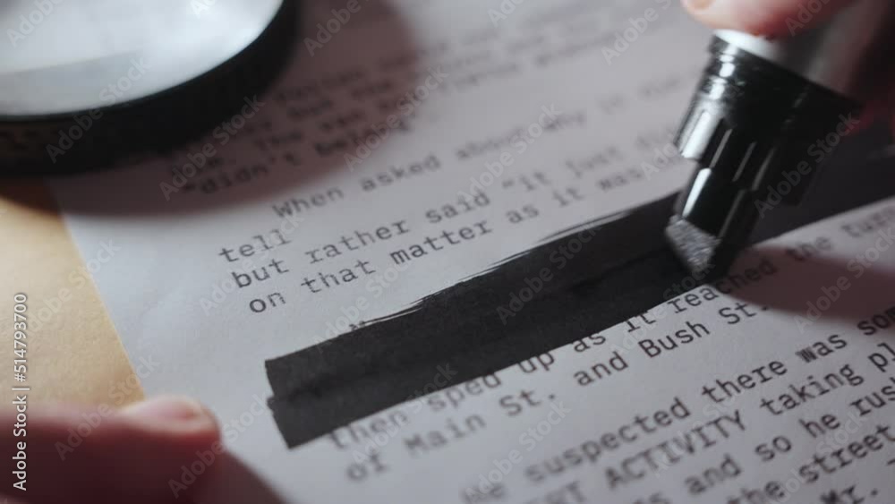 Video Stock Close up on hand censoring classified text and paper with ...