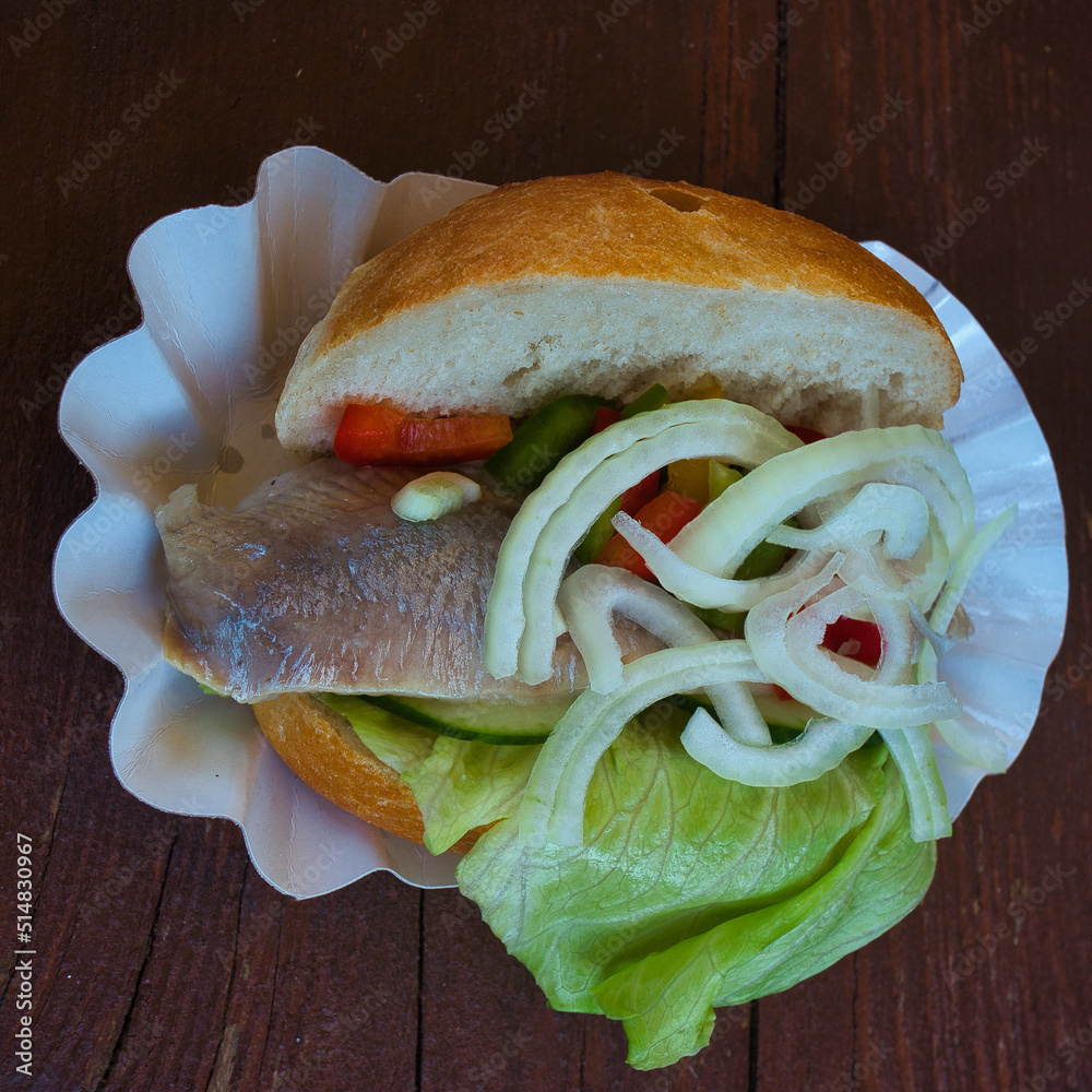 Fischbrötchen, Matjes mit Zwiebel und Salat im Brötchen Stock Photo ...