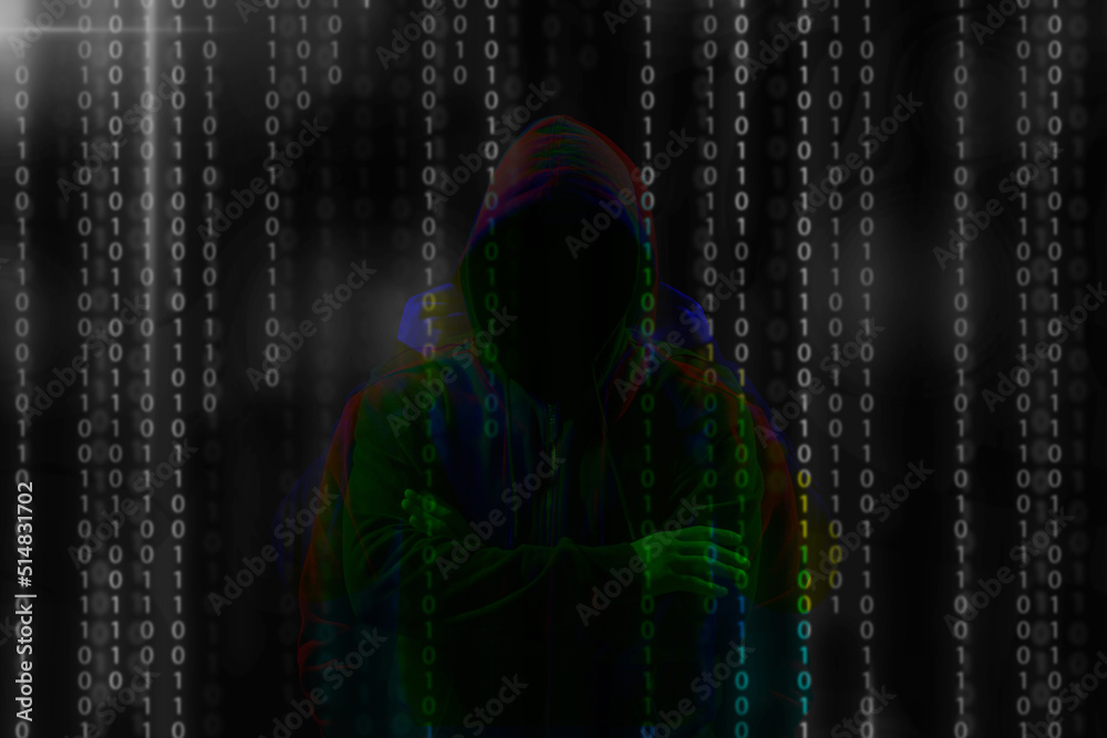 Silhouette of anonymous hacker and digital binary code on dark ...