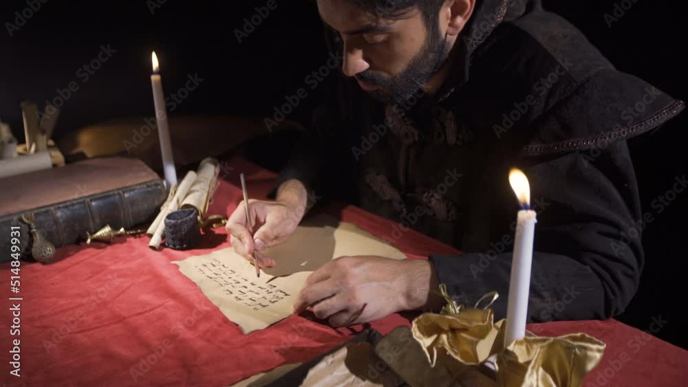 Europe in the Middle Ages. Medieval man writing letters by candlelight ...