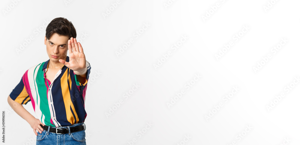 Serious young man extend hand, showing stop gesture, disapprove and ...